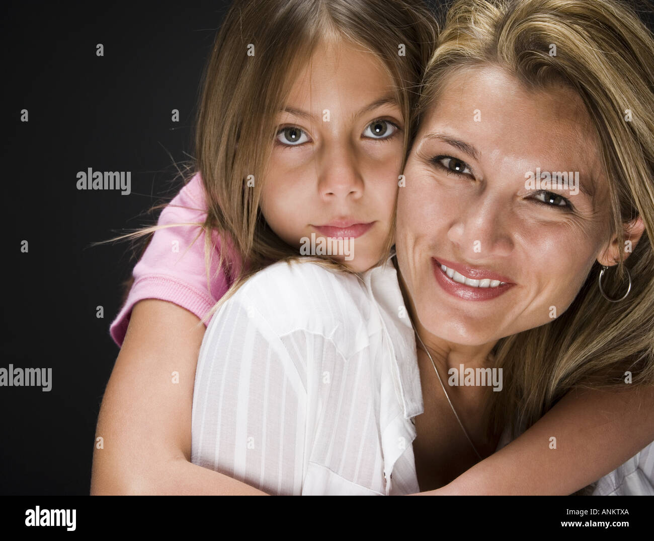 Portrait of a daughter hugging her mother Stock Photo - Alamy