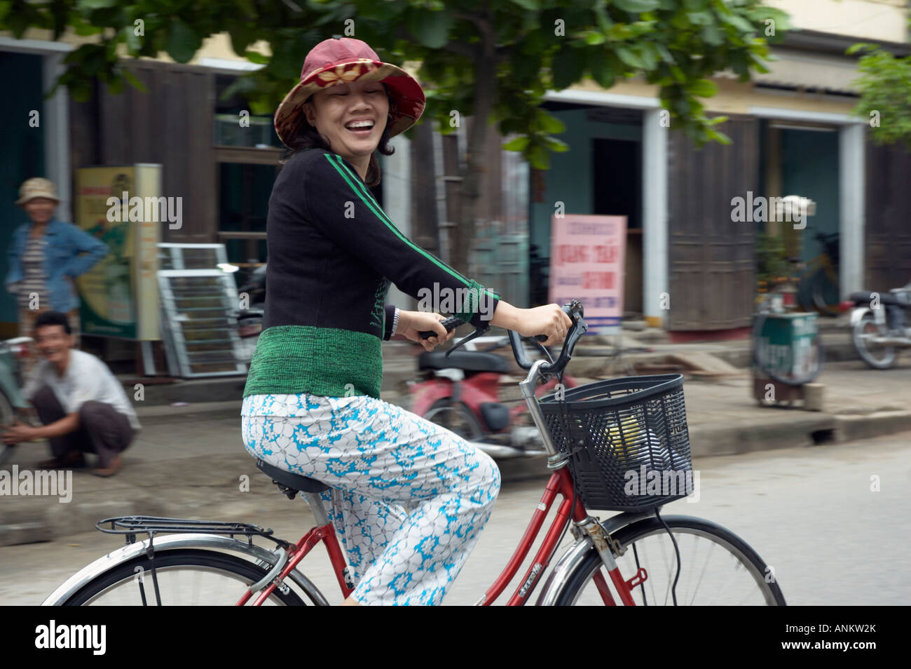 Smiling Vietnamese Woman On A Bicycle, Hoi An, Vietnam Stock Photo - Alamy