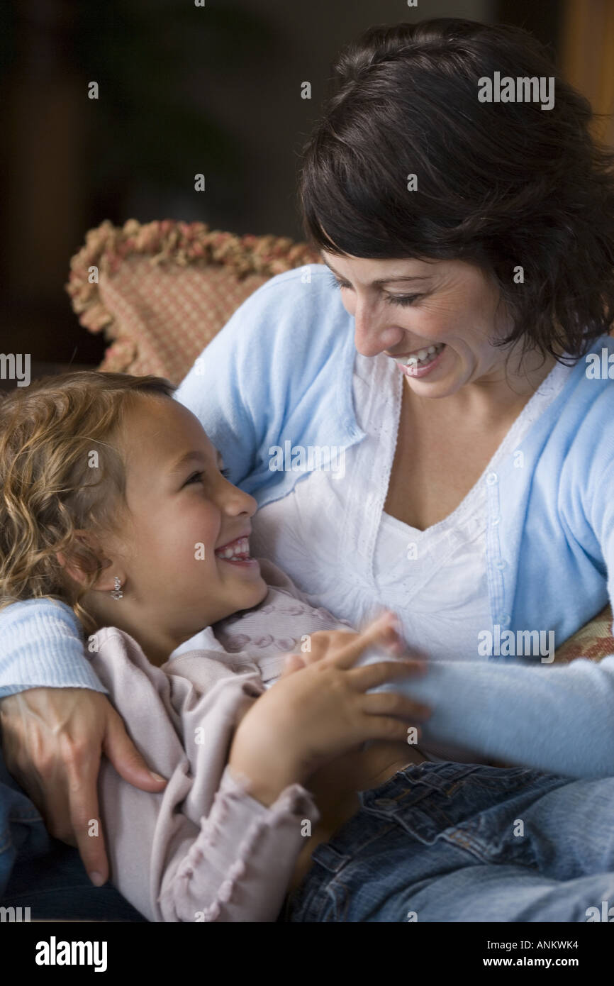 Close up of a mother tickling her daughter Stock Photo - Alamy