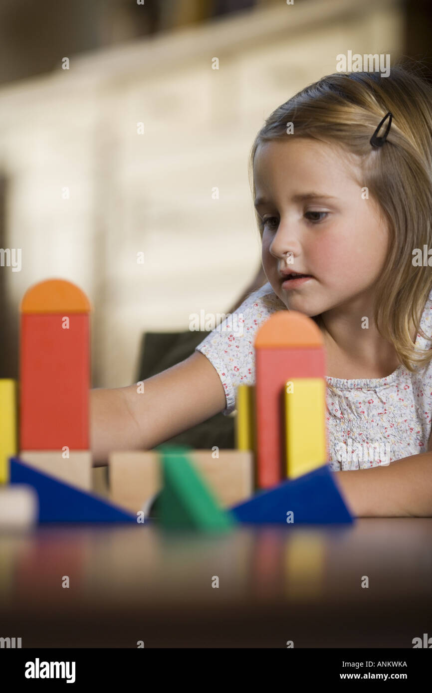 Girl building blocks lying down hi-res stock photography and images - Alamy