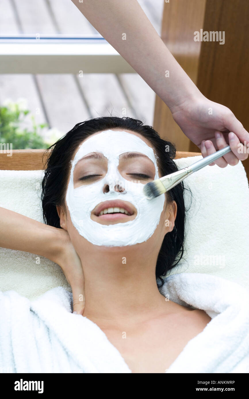 Woman with facial mask Stock Photo - Alamy