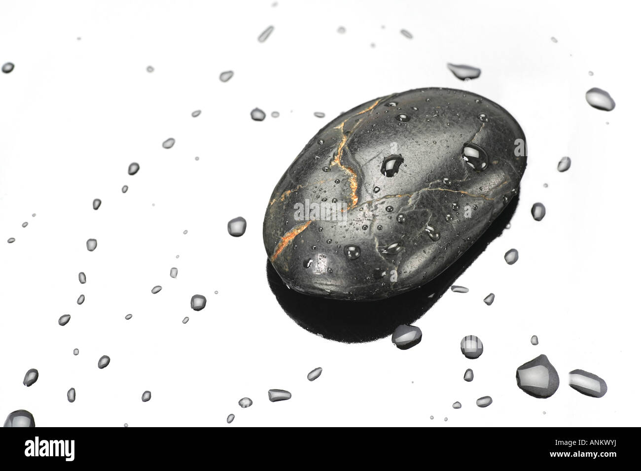 Spa volcanic pebble with water drops on white background Stock Photo ...