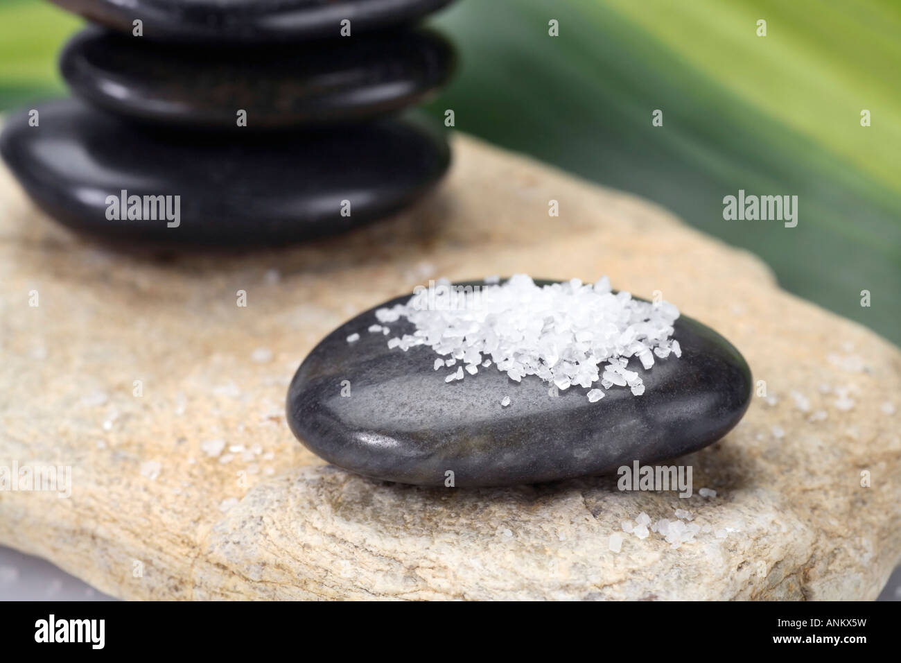 Spa volcanic pebbles with bath salts Stock Photo - Alamy