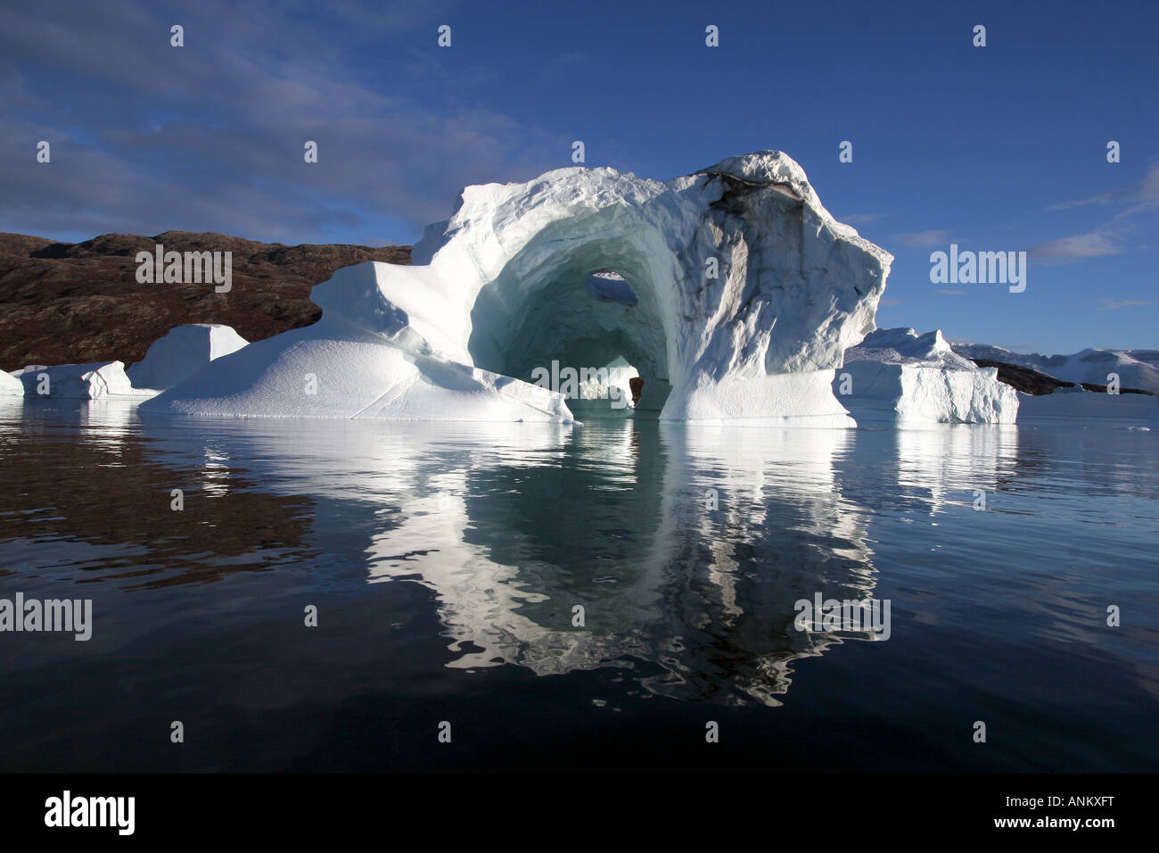 huge iceberg arch in greenland Stock Photo - Alamy