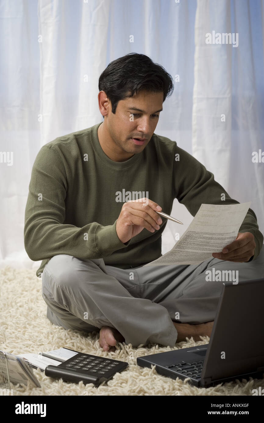 Man sitting on the floor and working Stock Photo - Alamy