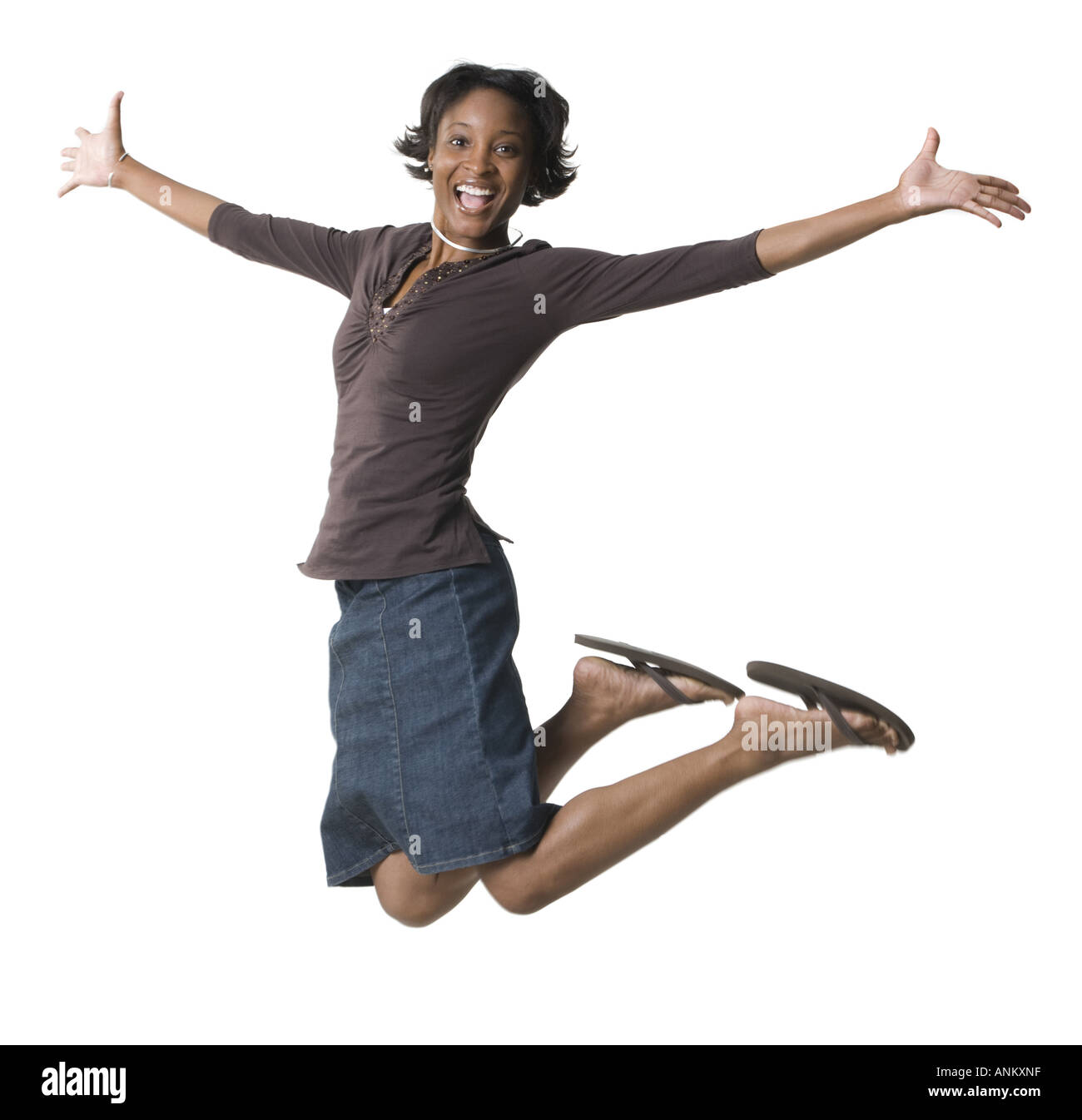 Side profile young woman jumping Cut Out Stock Images & Pictures - Alamy