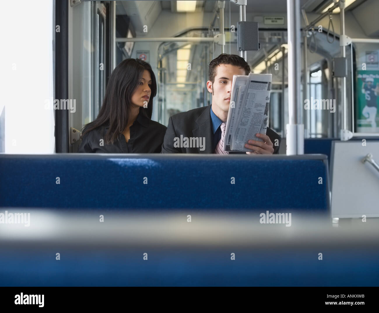 Woman reading newspaper train hi-res stock photography and images - Alamy