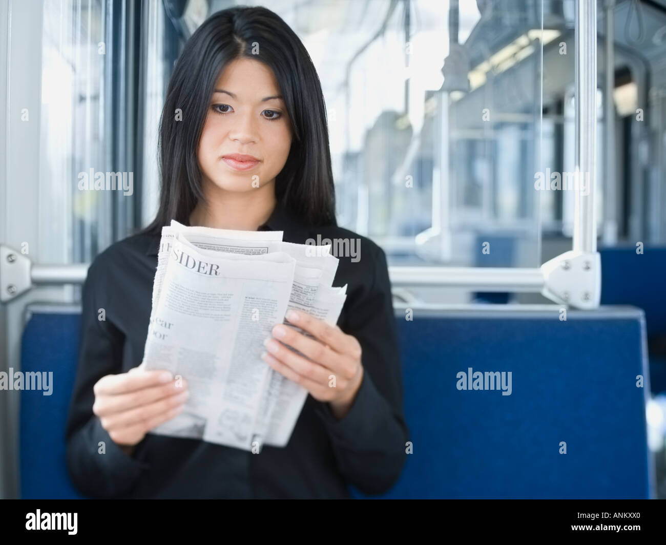 Person holding newspaper on train hi-res stock photography and images ...