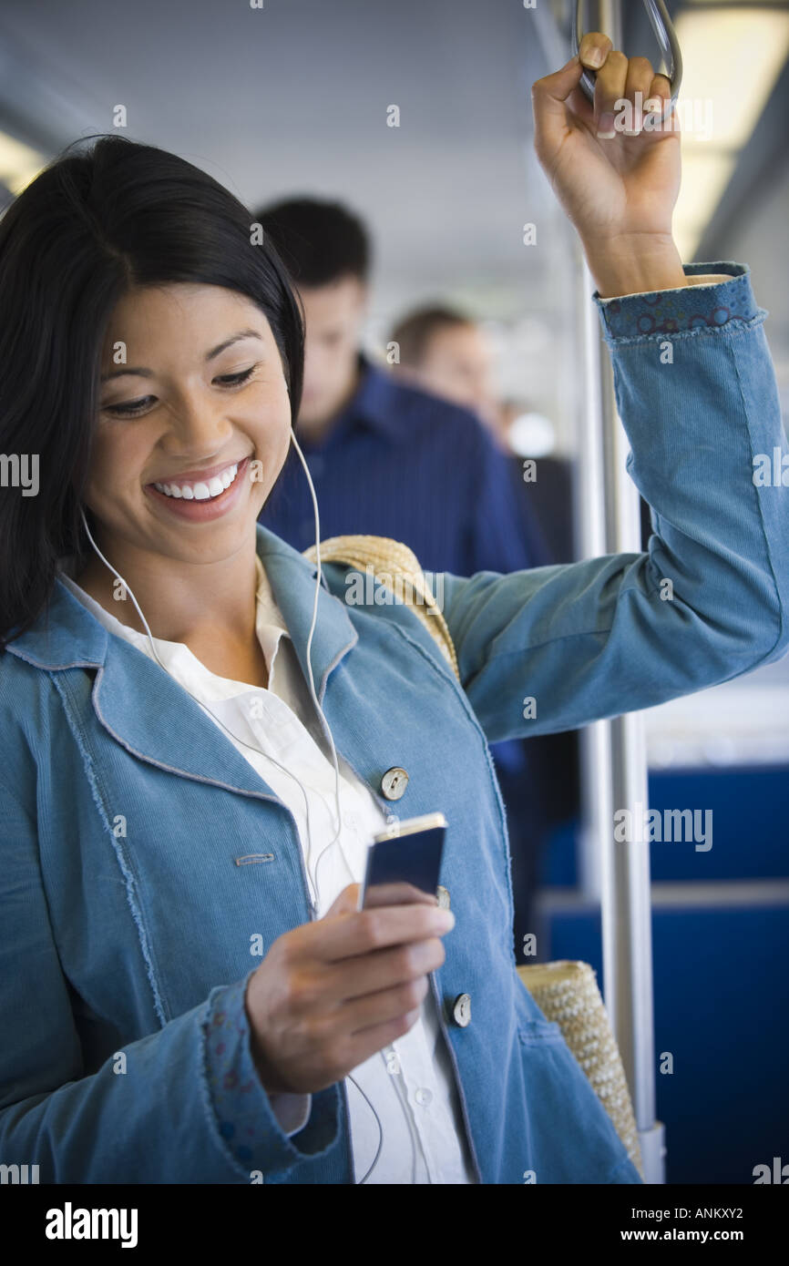 Listening to ipod on train hi-res stock photography and images - Alamy