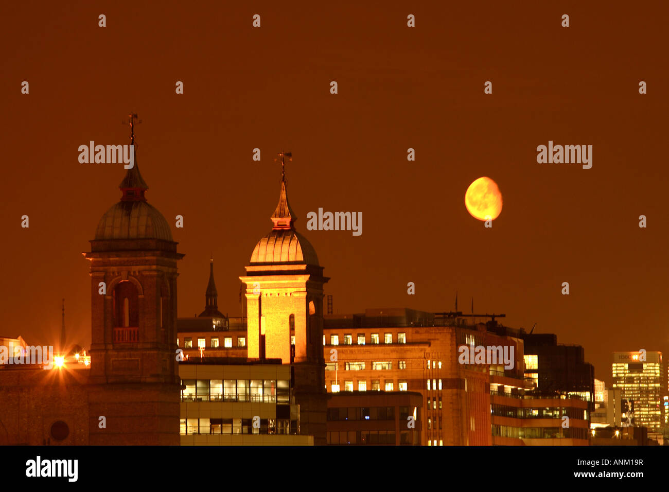 London Cityscape with Orange Moon Stock Photo - Alamy