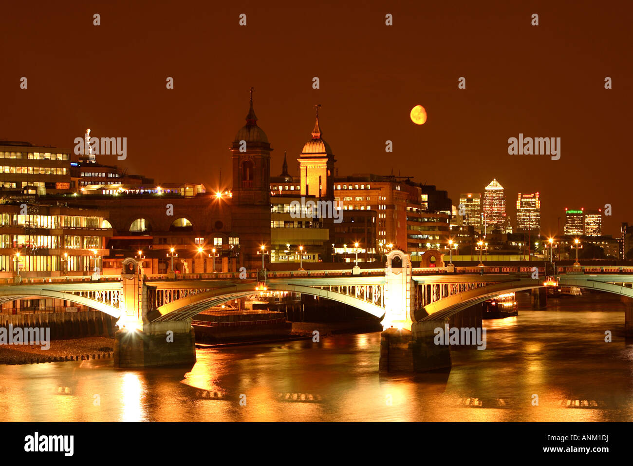 London Cityscape with Orange Moon Stock Photo - Alamy