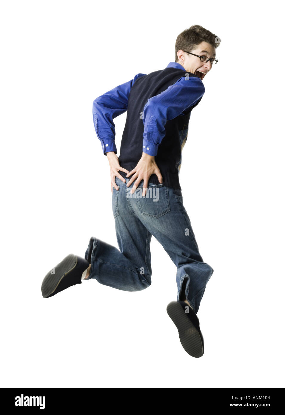 Profile of a young man jumping with his hands on his back Stock Photo ...