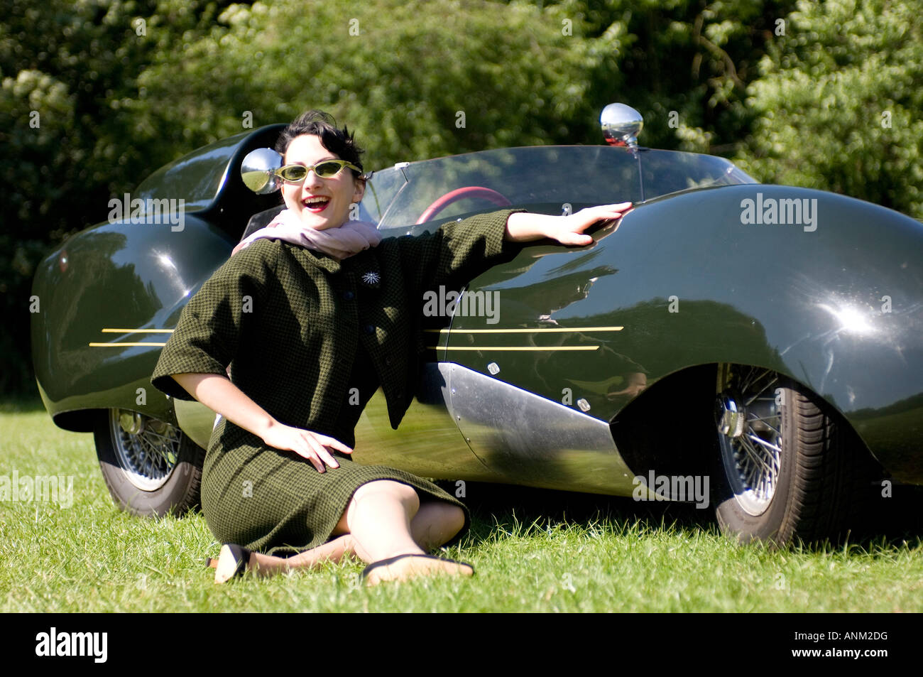 A young woman with a classic sports car Stock Photo - Alamy