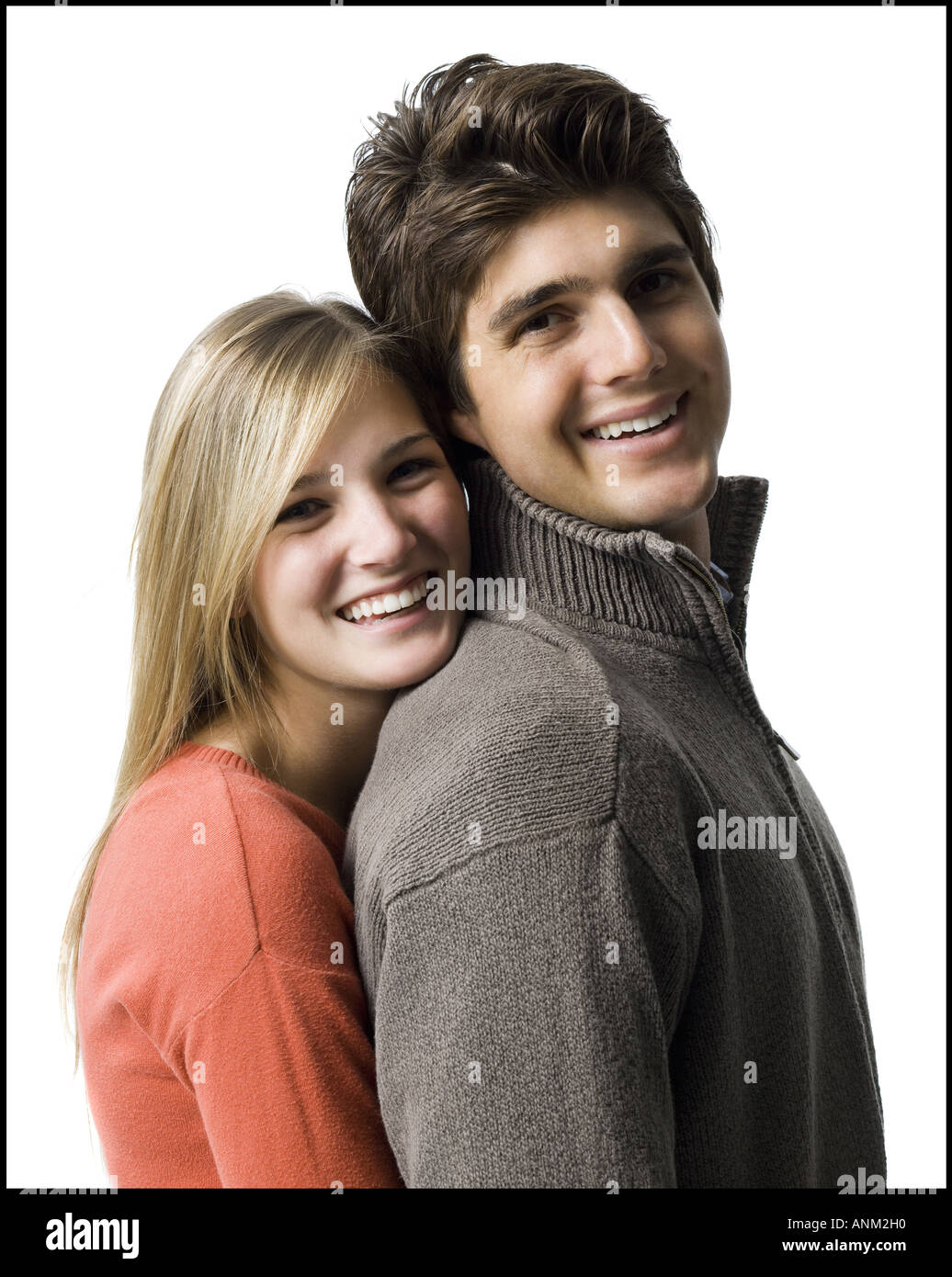 Portrait of a young woman embracing a young man Stock Photo - Alamy