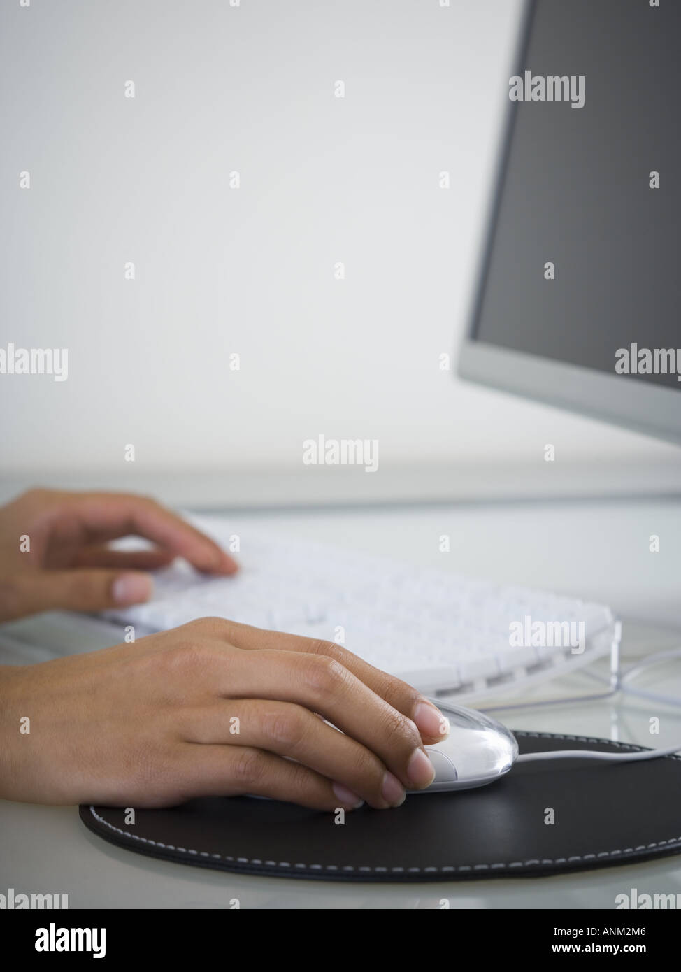 Hand using mouse connected hi-res stock photography and images - Alamy