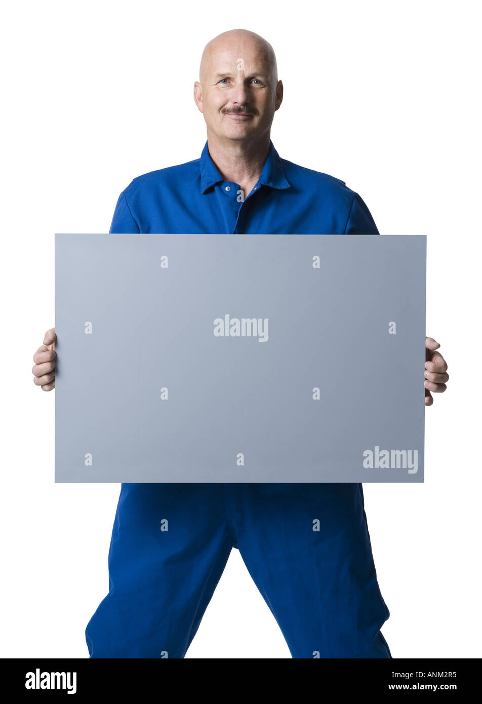 Portrait of a man holding up a blank sign Stock Photo - Alamy