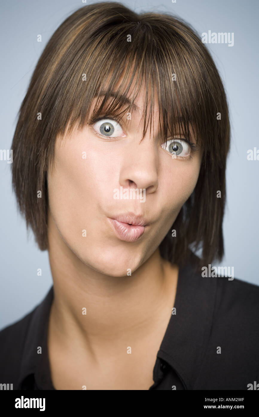 Portrait of a teenage girl making a face Stock Photo - Alamy