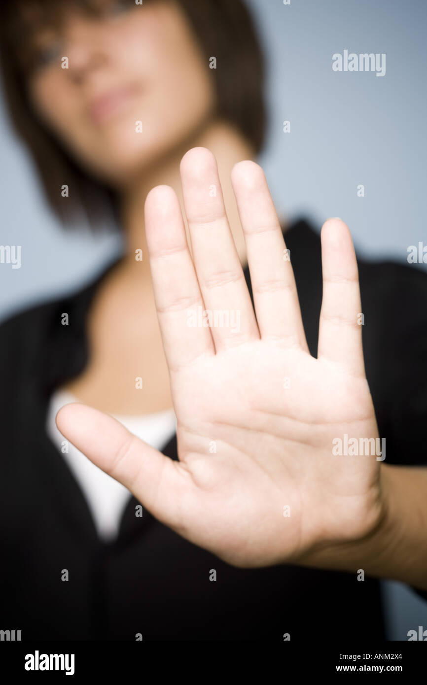 Teenage girl making a stop gesture Stock Photo - Alamy