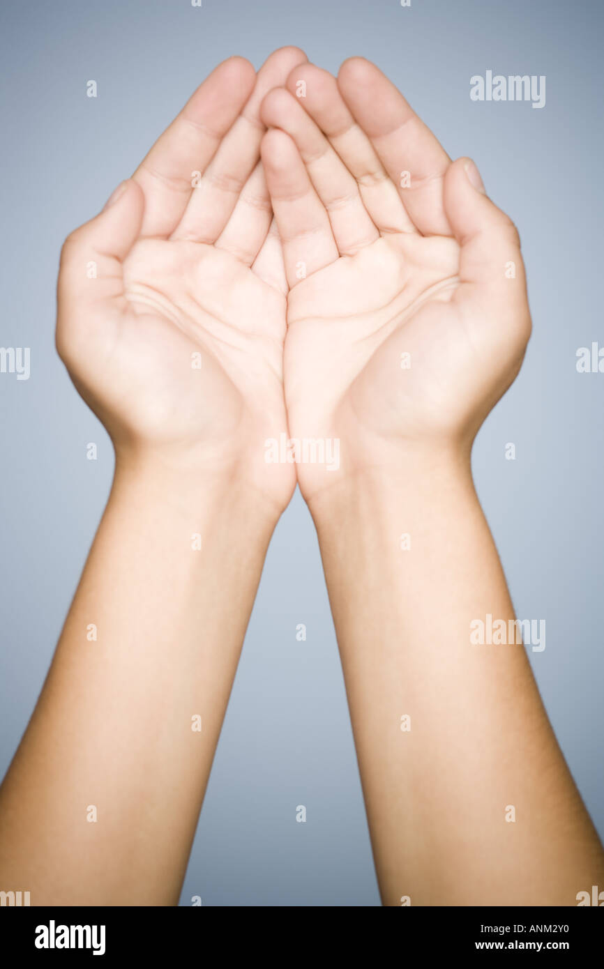 High angle view of a person s hands cupped sign language for gift Stock ...