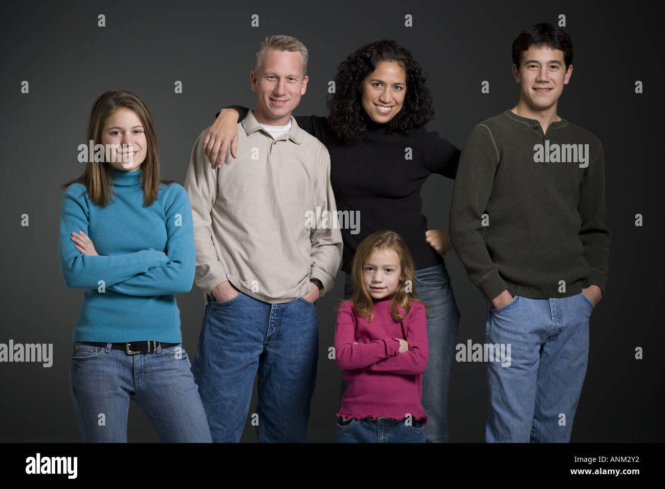 Portrait of a family mother father and three siblings Stock Photo - Alamy