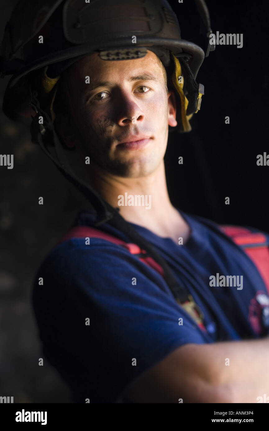Portrait of a firefighter wearing a safety helmet Stock Photo - Alamy