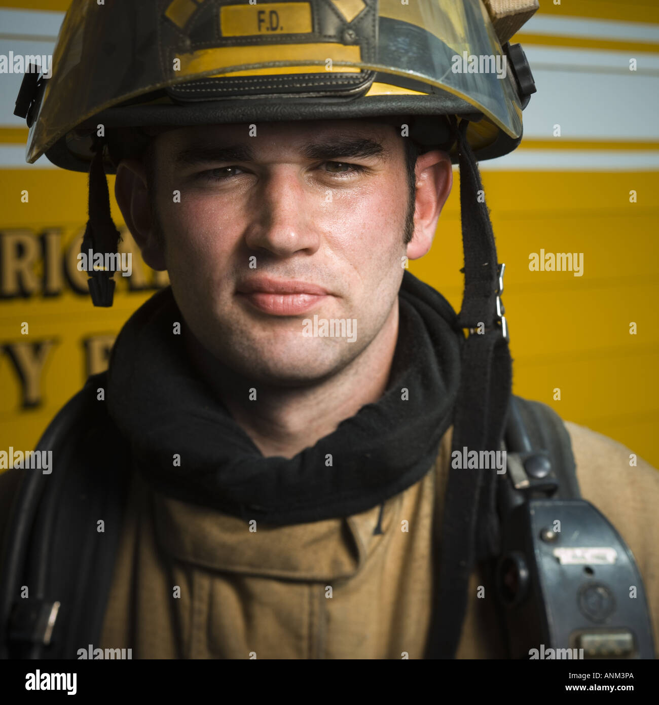 Portrait of a firefighter wearing a helmet Stock Photo - Alamy