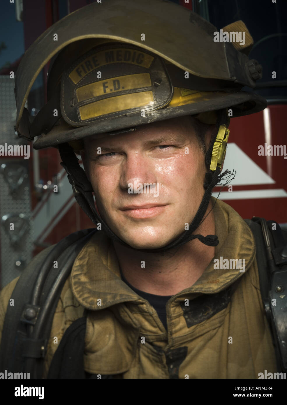 Portrait of a firefighter wearing a helmet Stock Photo - Alamy