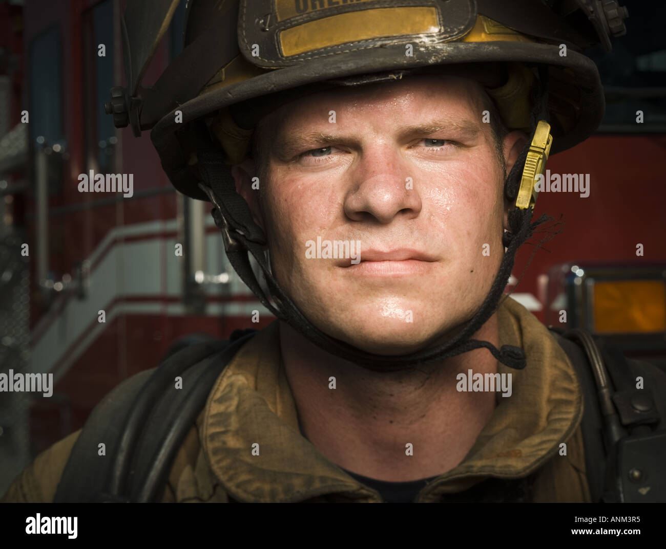 Portrait of a firefighter wearing a helmet Stock Photo - Alamy