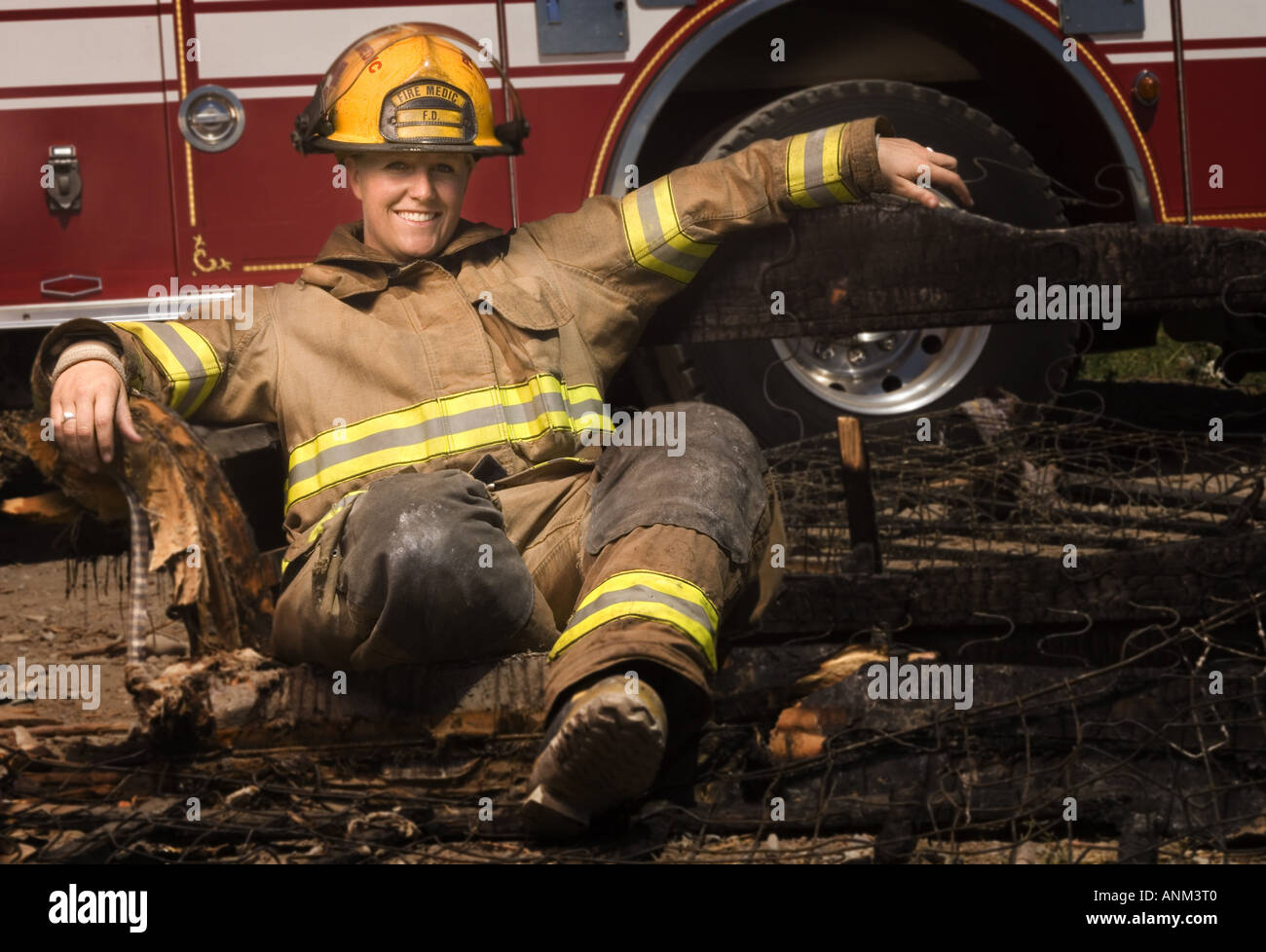 Portrait of a female firefighter smiling Stock Photo - Alamy