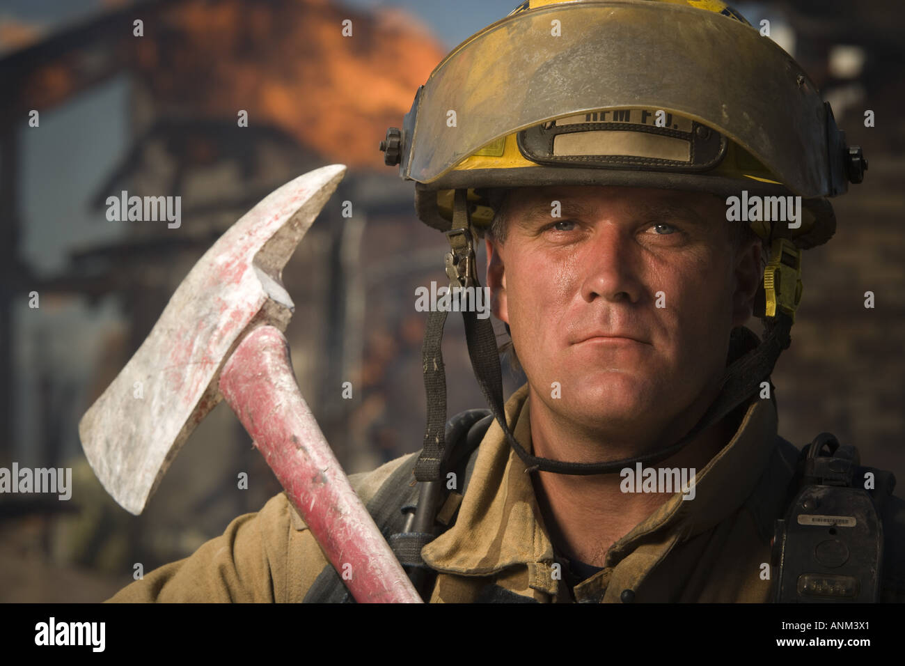 Portrait of a firefighter with an axe Stock Photo - Alamy