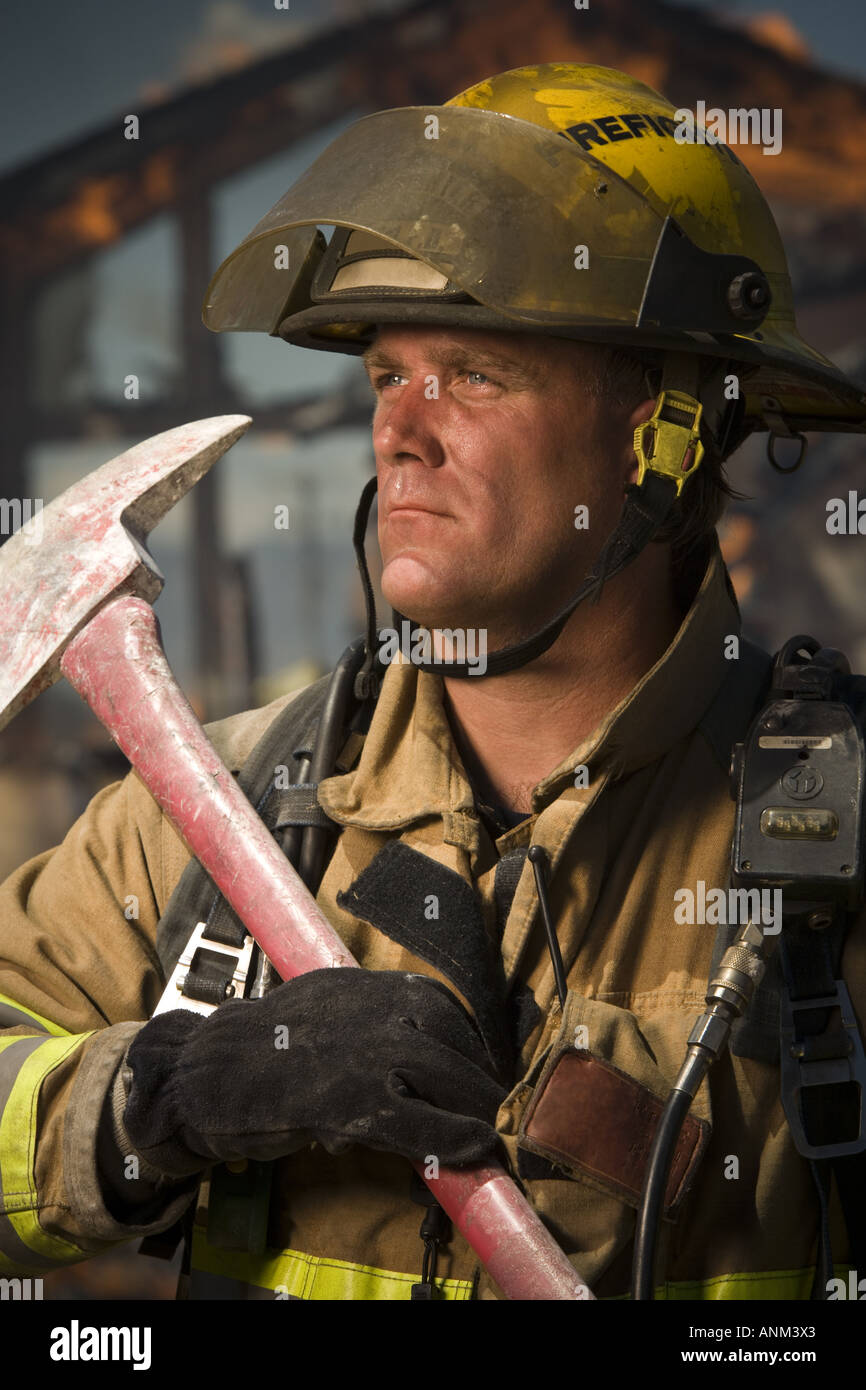 Close up of a firefighter holding an axe Stock Photo - Alamy