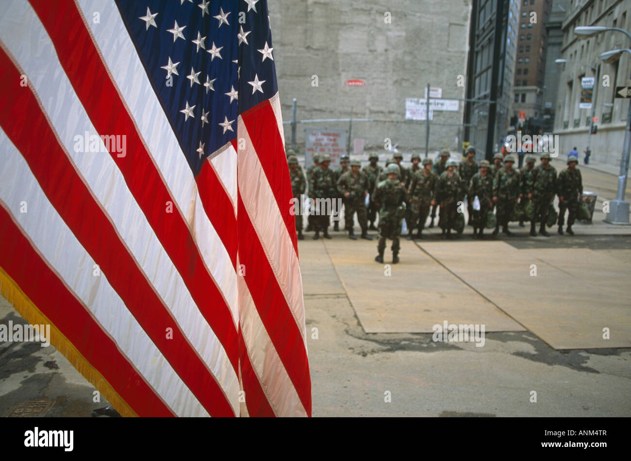 US National Guard volunteers parade by Stars and Stripes flag before ...