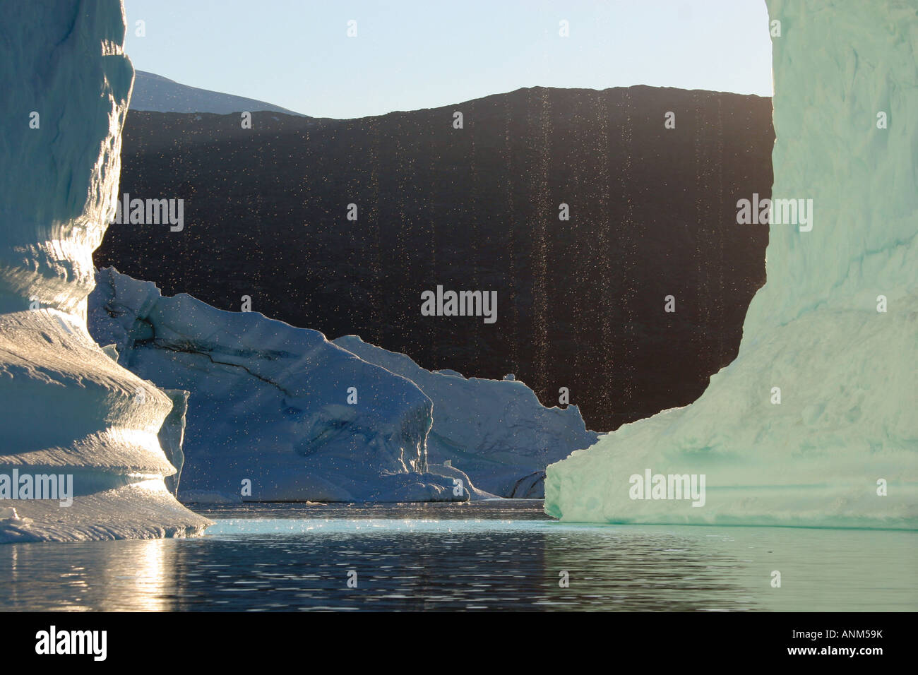 melting iceberg arch in greenland Stock Photo - Alamy