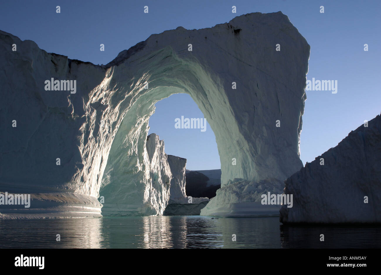 huge iceberg arch in greenland Stock Photo - Alamy
