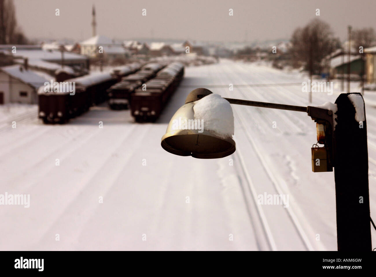 Dented snow covered lamp at the trains station in Brcko, Bosnia ...