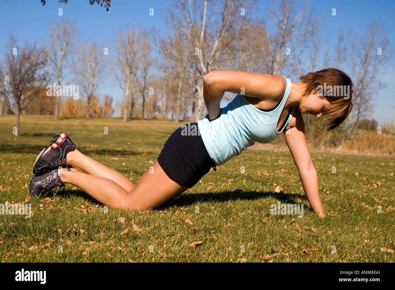 woman doing "one armed push ups Stock Photo - Alamy