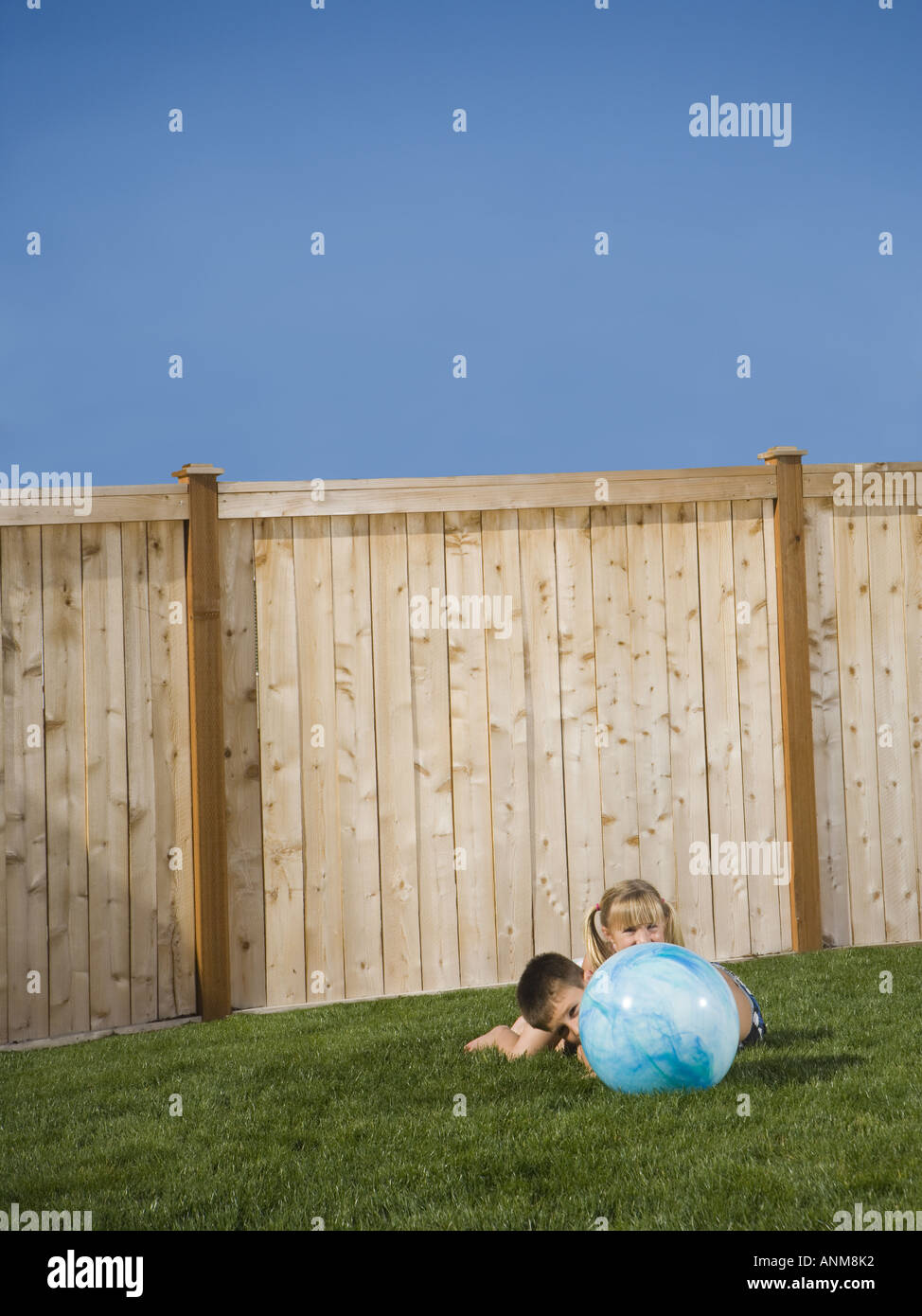 Children playing behind a fence hi-res stock photography and images - Alamy