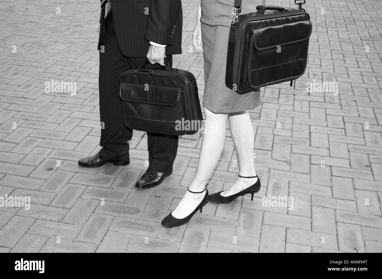 Black and white photo of business people carrying laptop bags Stock ...