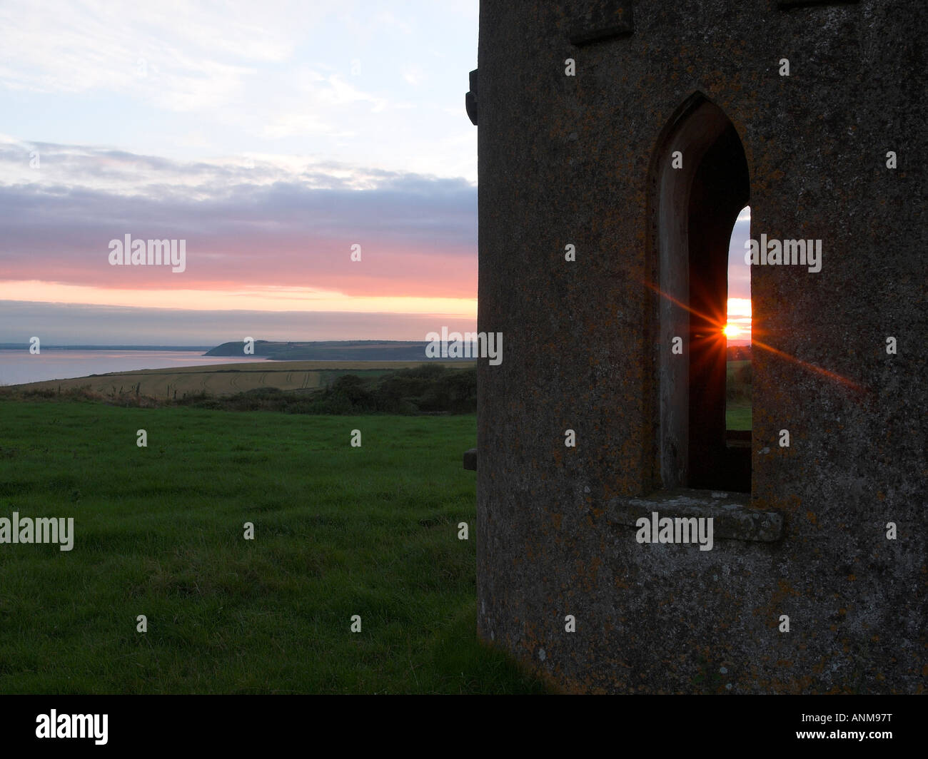 Setting sun shining through window of castle, Ireland Stock Photo - Alamy