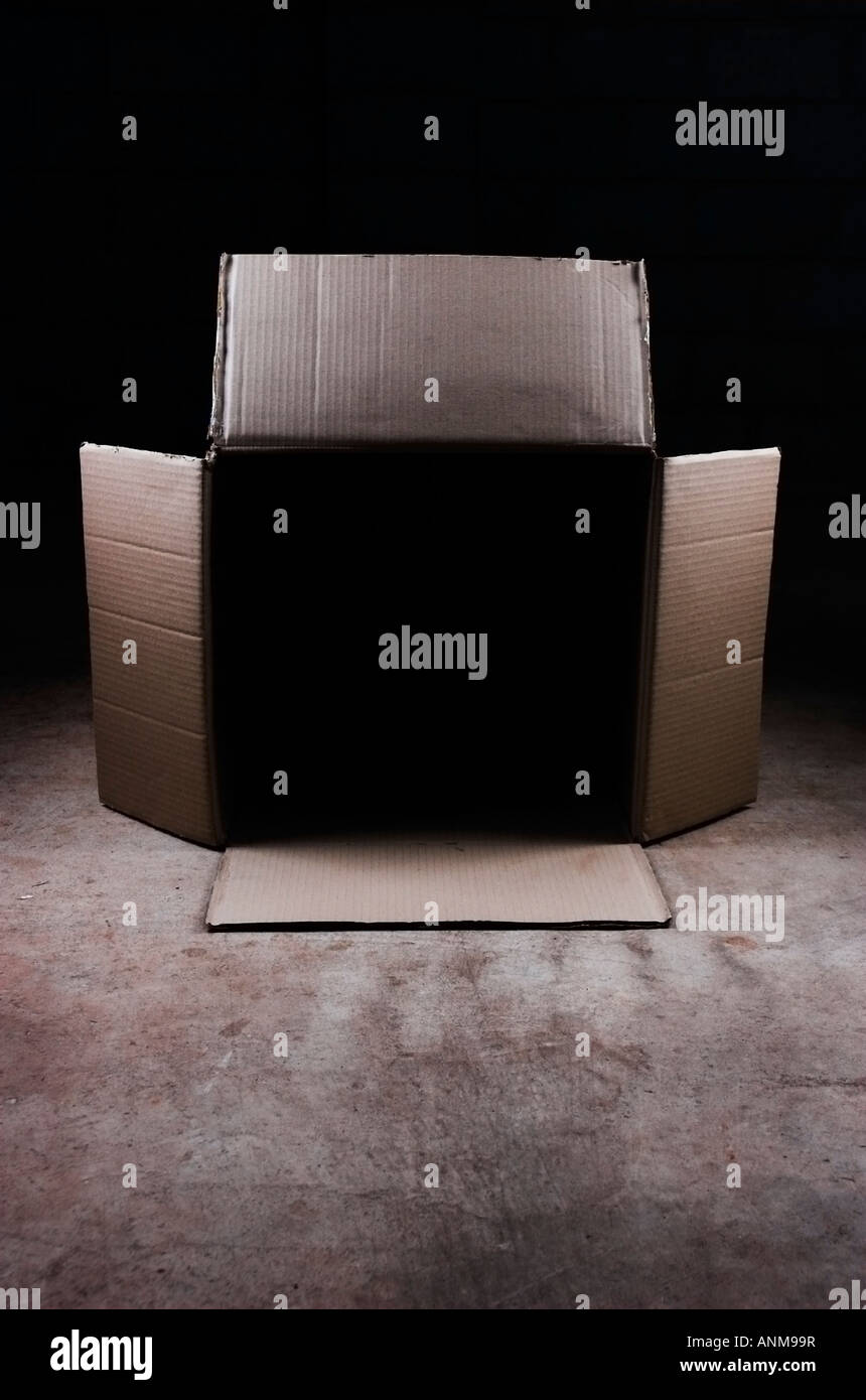Dark void inside a large cardboard box Stock Photo - Alamy