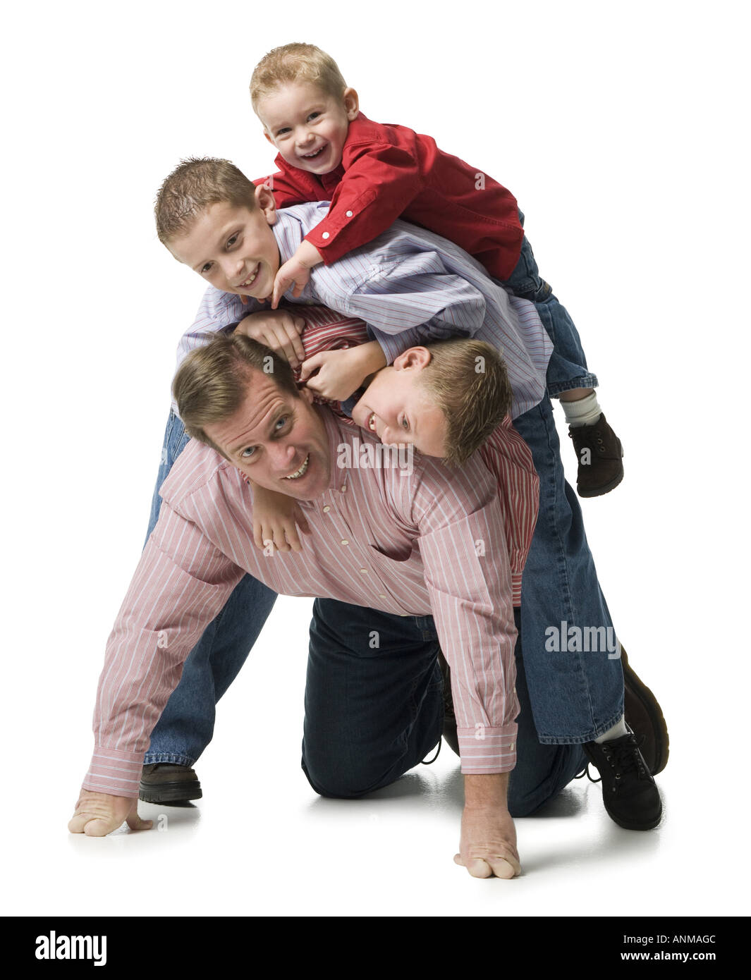 Portrait of three children riding on their father s back Stock Photo ...