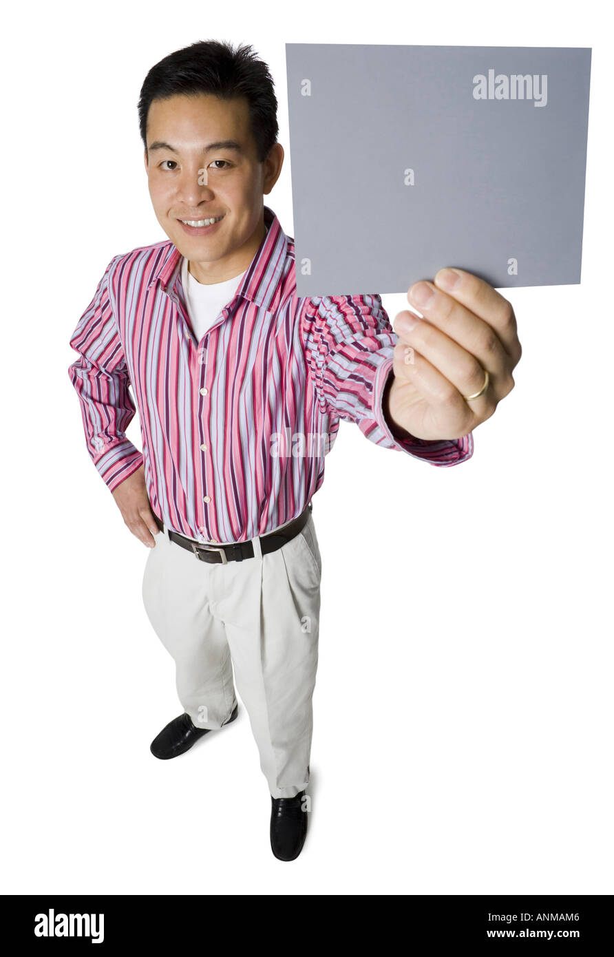 Asian man holding vertical Cut Out Stock Images & Pictures - Alamy