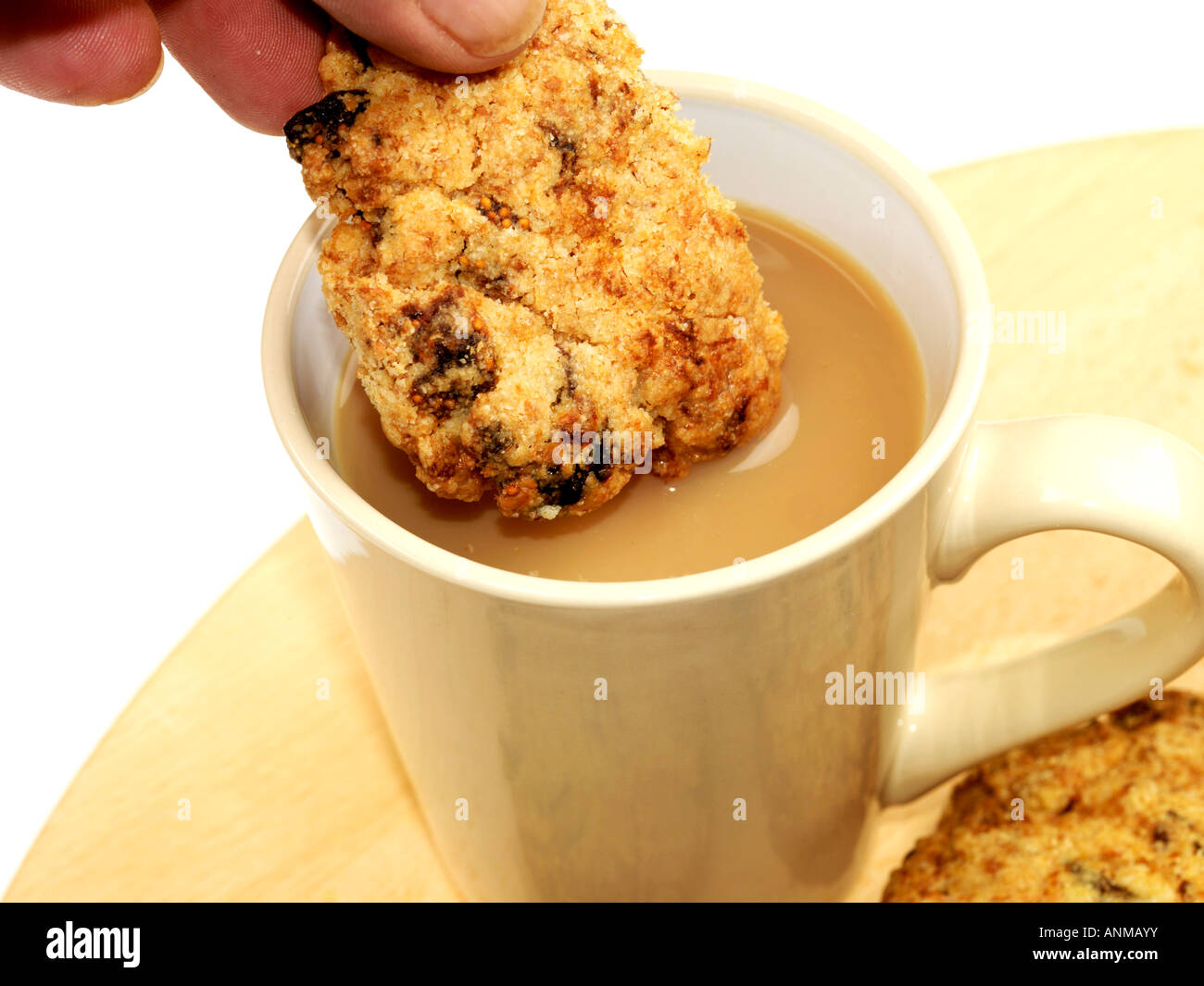 Dipping biscuit in tea hi-res stock photography and images - Alamy