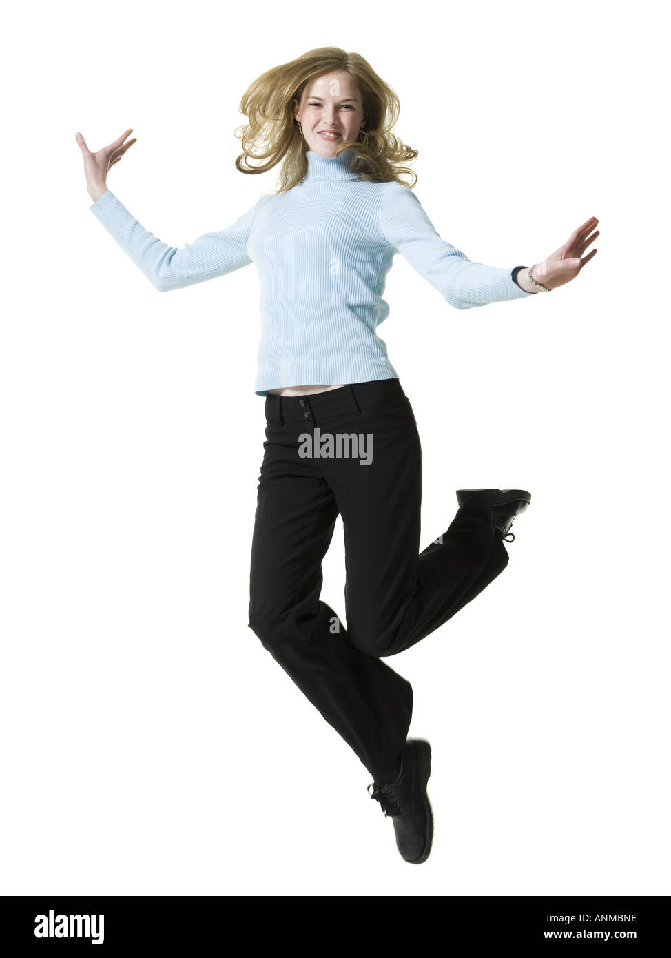 Portrait of a young woman jumping Stock Photo - Alamy