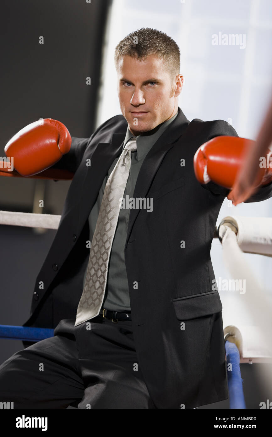 Portrait of a young man sitting in a boxing ring Stock Photo - Alamy
