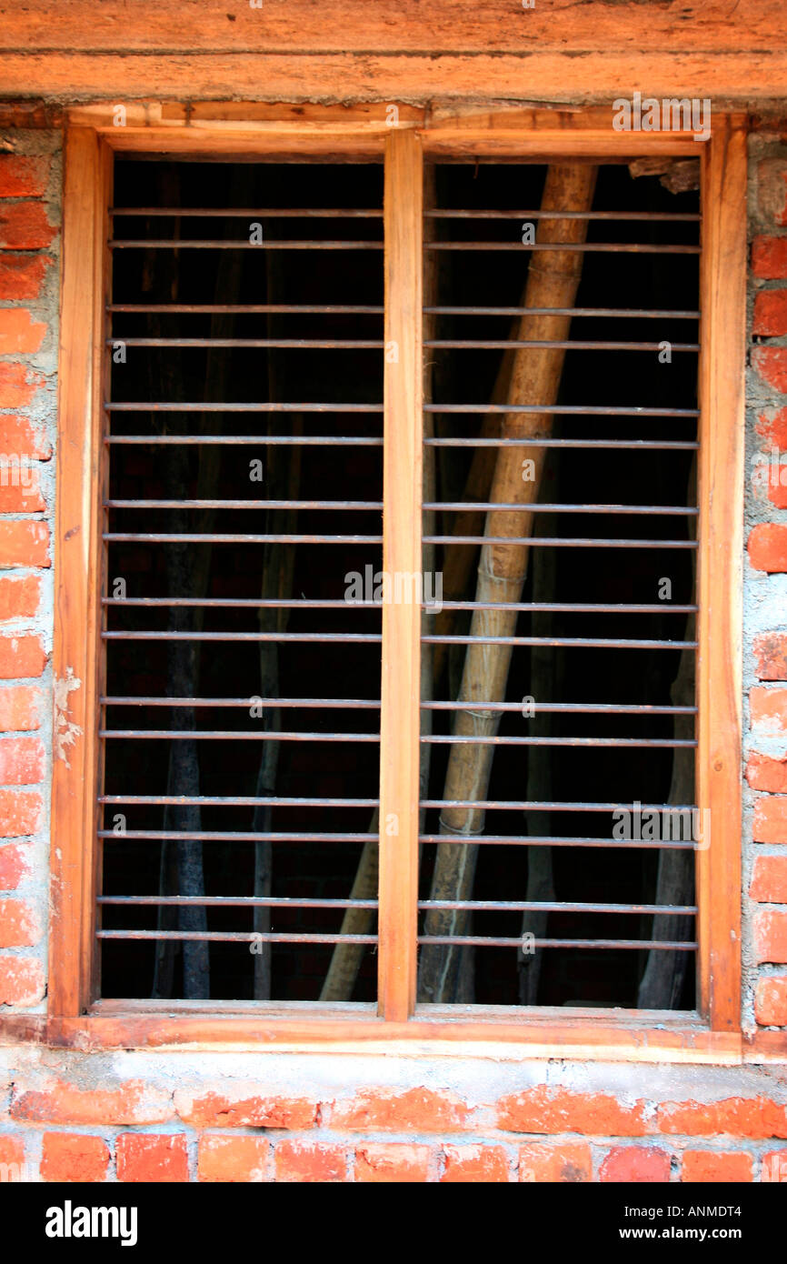 A window through which is seen the inside of a building under ...