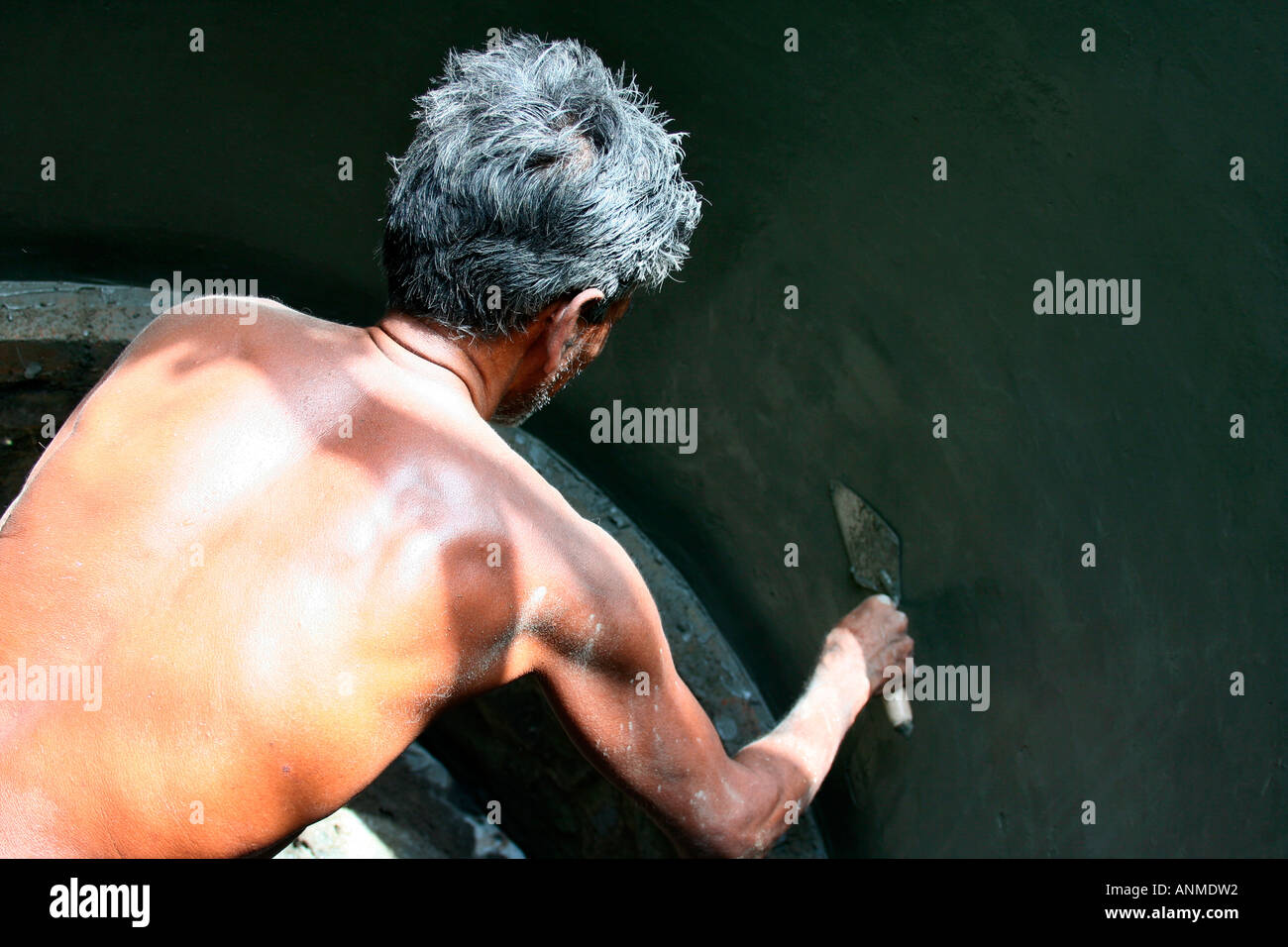 Stooping man hi-res stock photography and images - Alamy