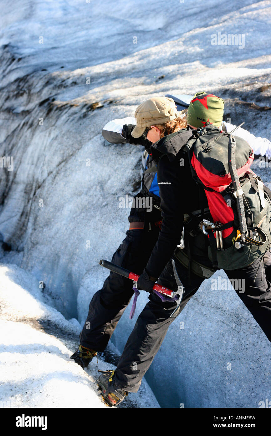 Man climbing vertical glacier ice hi-res stock photography and images ...