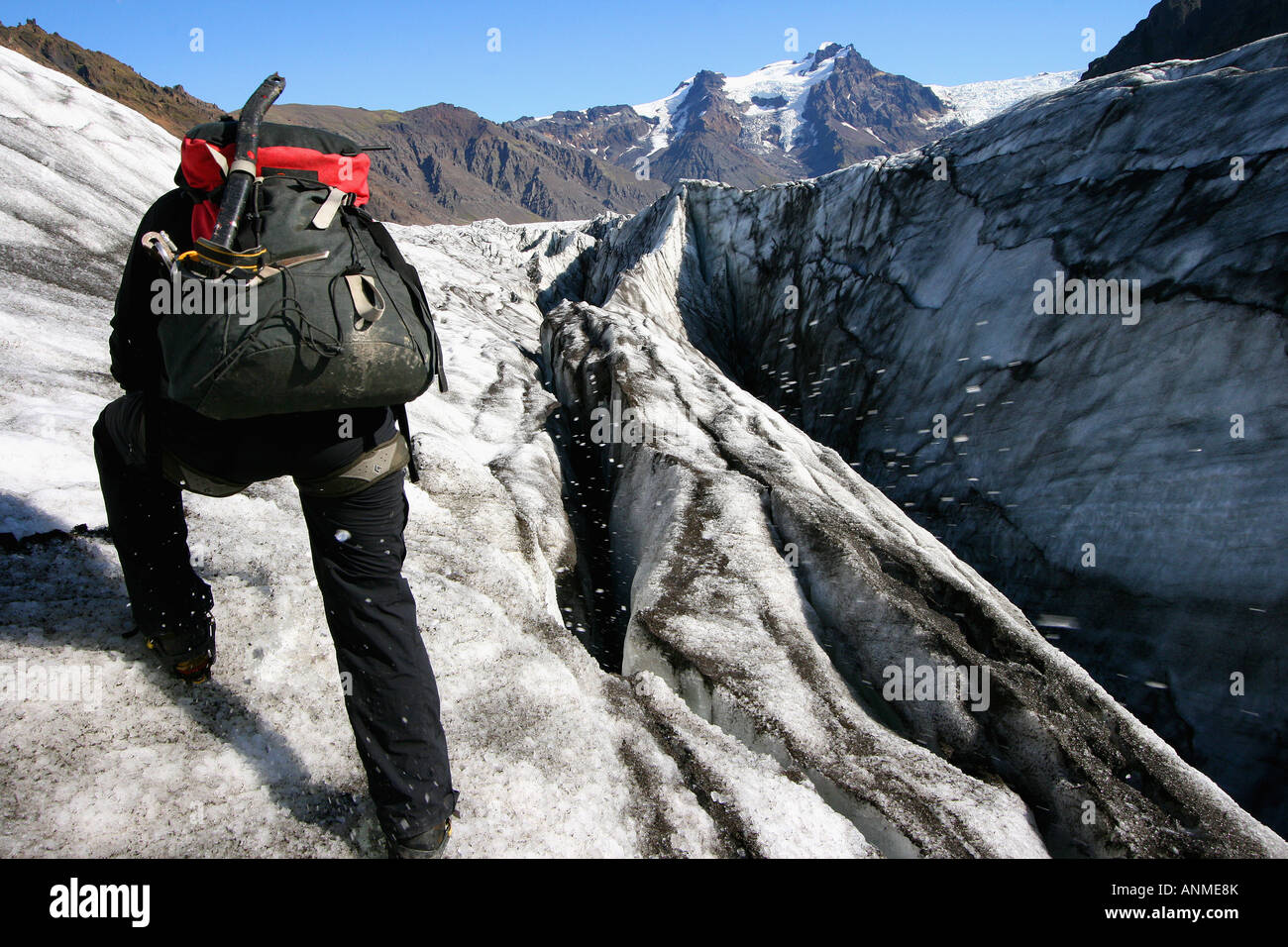 Glacier guide cutting steps in Vatnajokull glacier Iceland Stock Photo ...