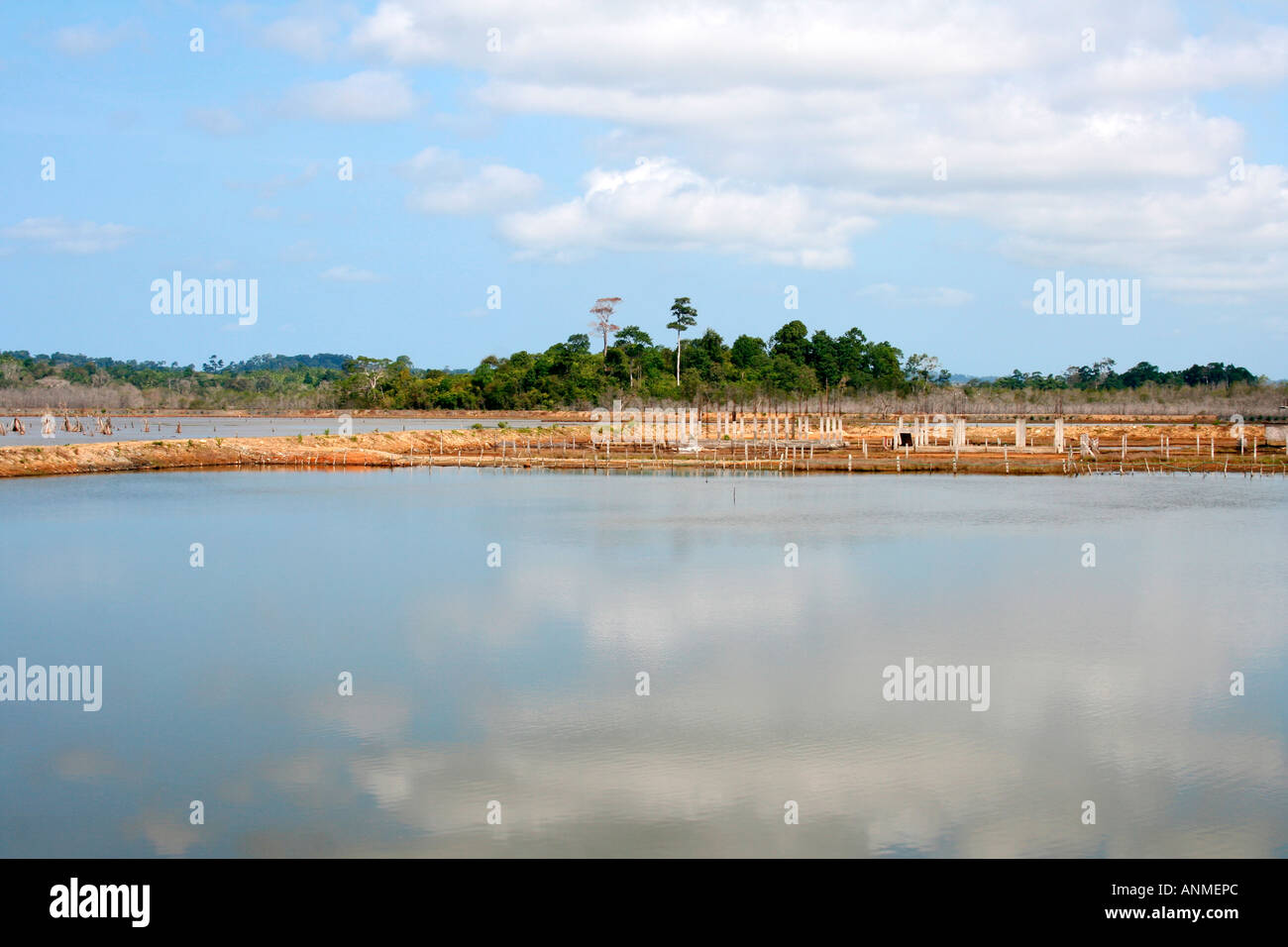 A flooded land area after Tsunami against landscape with reflection of ...